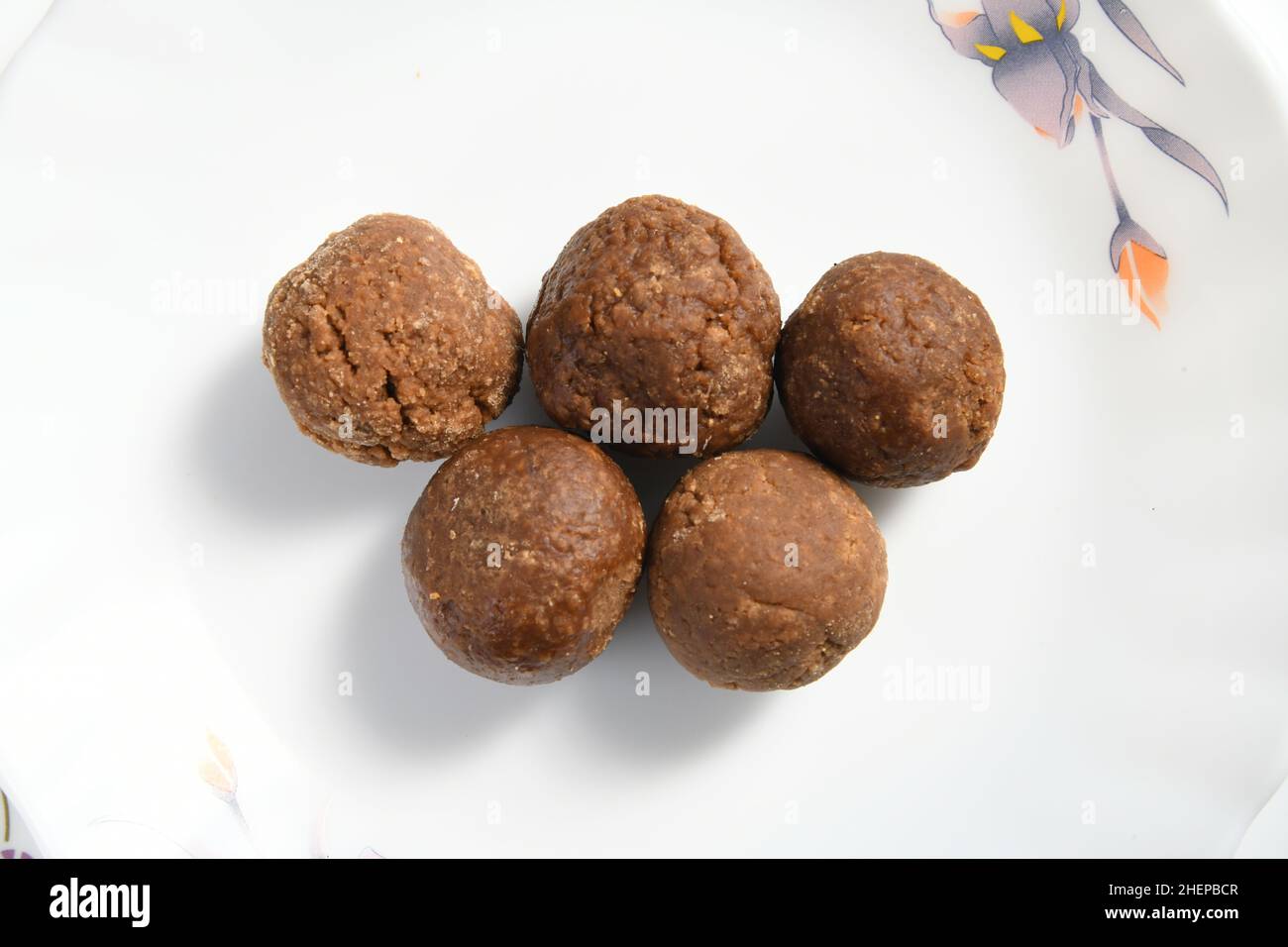 Coconut laddu. Traditional semi-fried Indian sweet made of coconut and ...