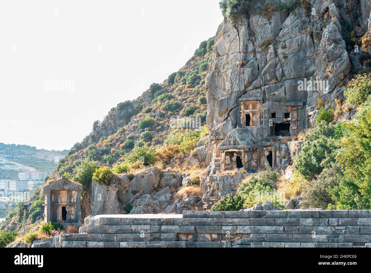 landscape of Demre town in Turkey - rock tombs of ancient Myra on the ...