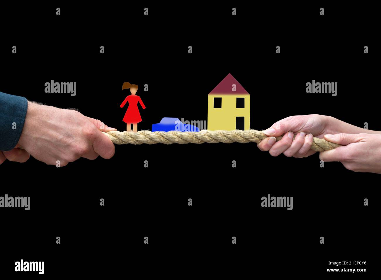 Male and female hands pull on a rope in dispute over divorce Stock ...