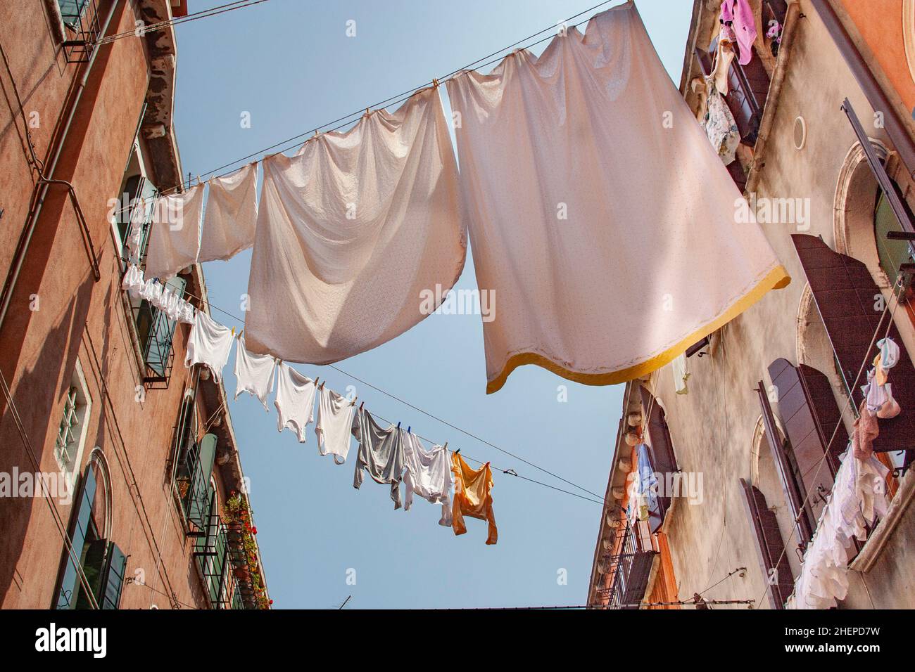 clothesline between houses in a small canal in Venice, Italy Stock ...