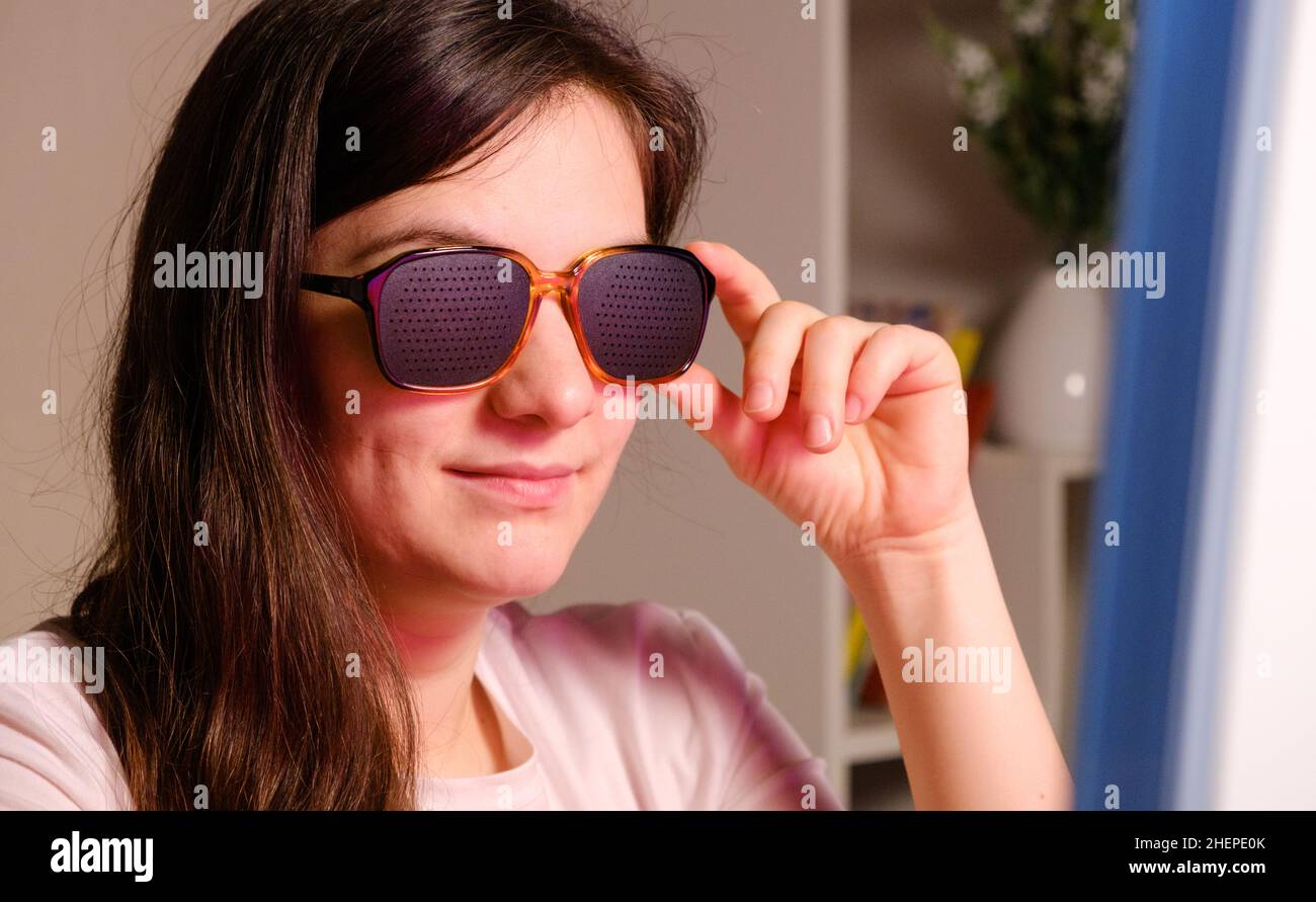 Woman in perforated glasses hi-res stock photography and images - Alamy