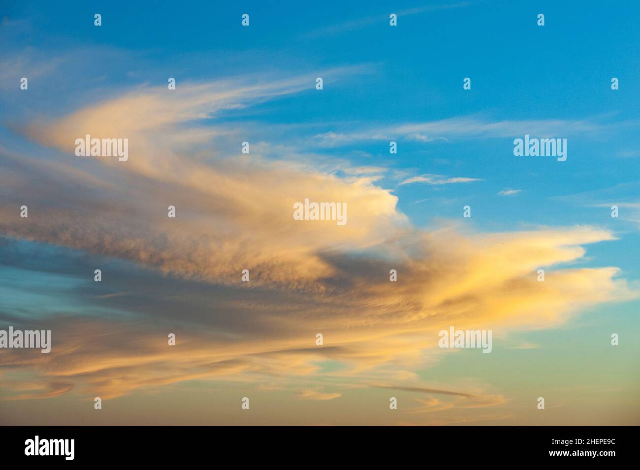 spectacular sunset with soft clouds in the desert Stock Photo - Alamy