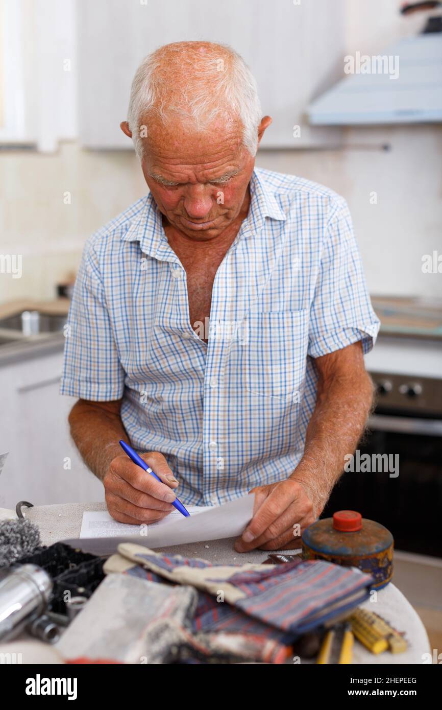 Thoughtful man planning renovation works Stock Photo - Alamy
