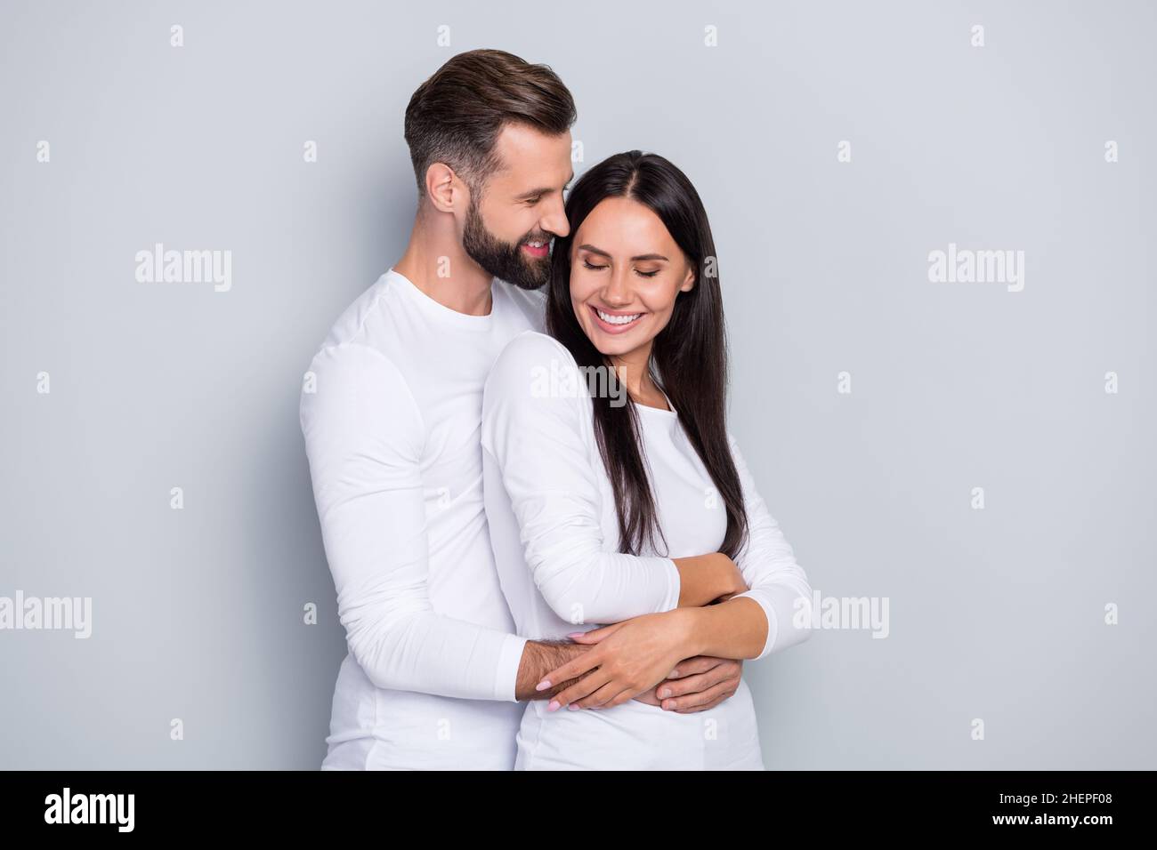 Portrait of attractive adorable cheerful couple soulmates hugging ...