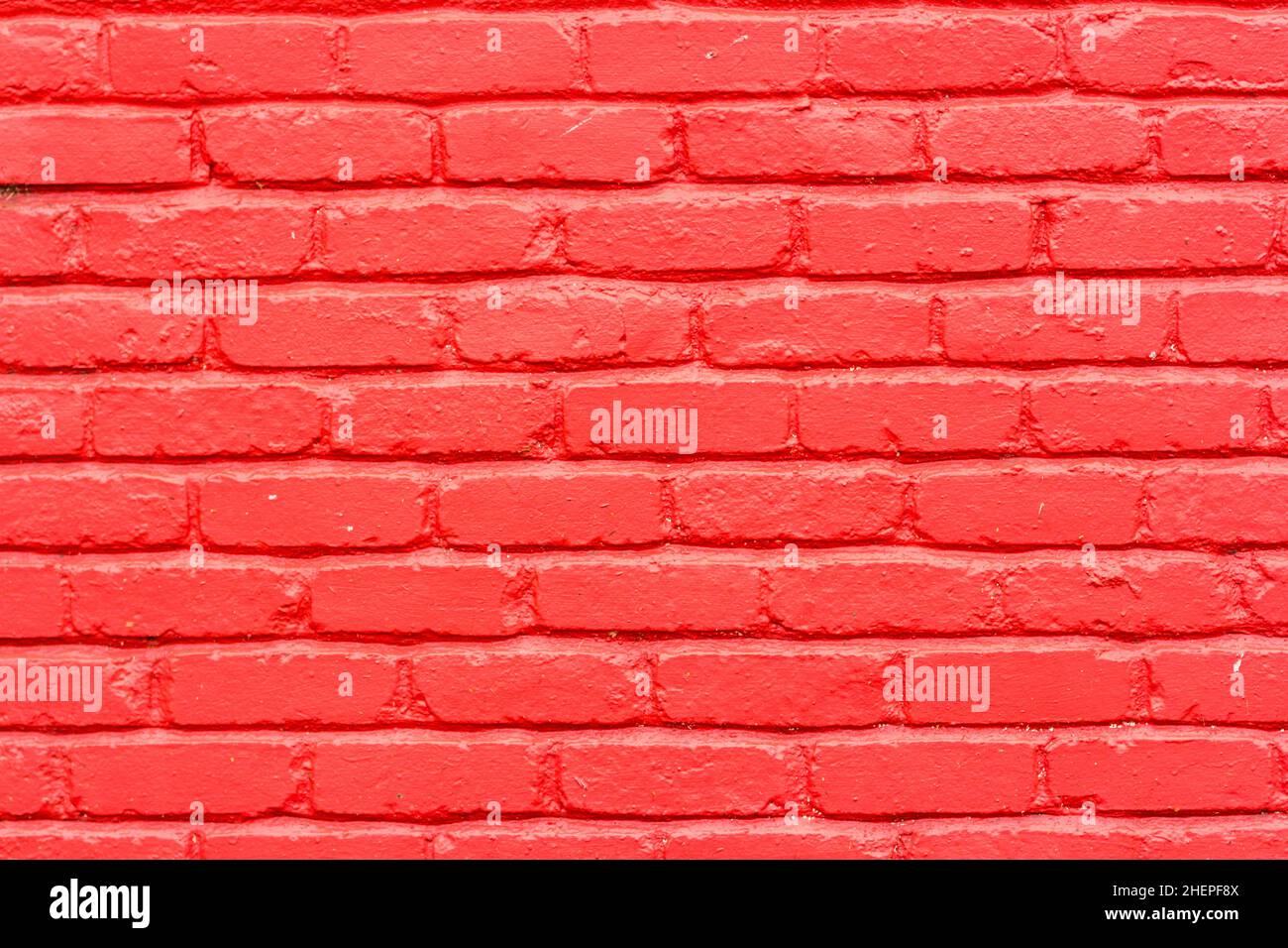 red painted bright harmonic brick wall gives a harmonic background ...