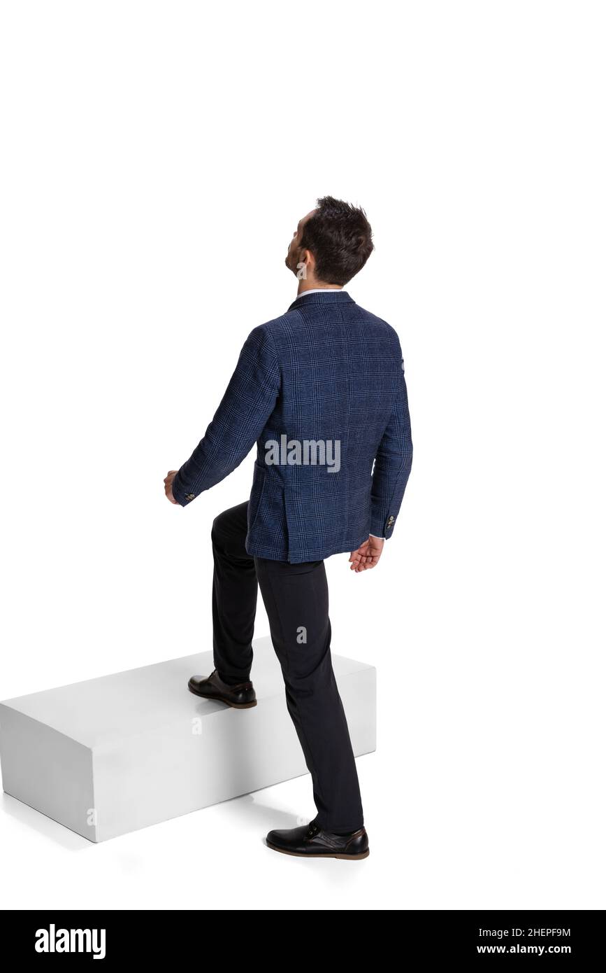 Full-length portrait of businessman, office worker making steps ...