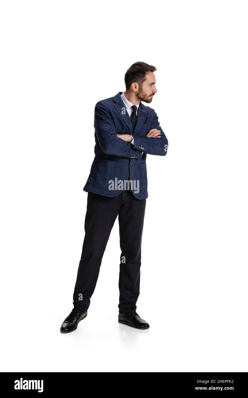 Full-length portrait of businessman with curious and concentrated ...