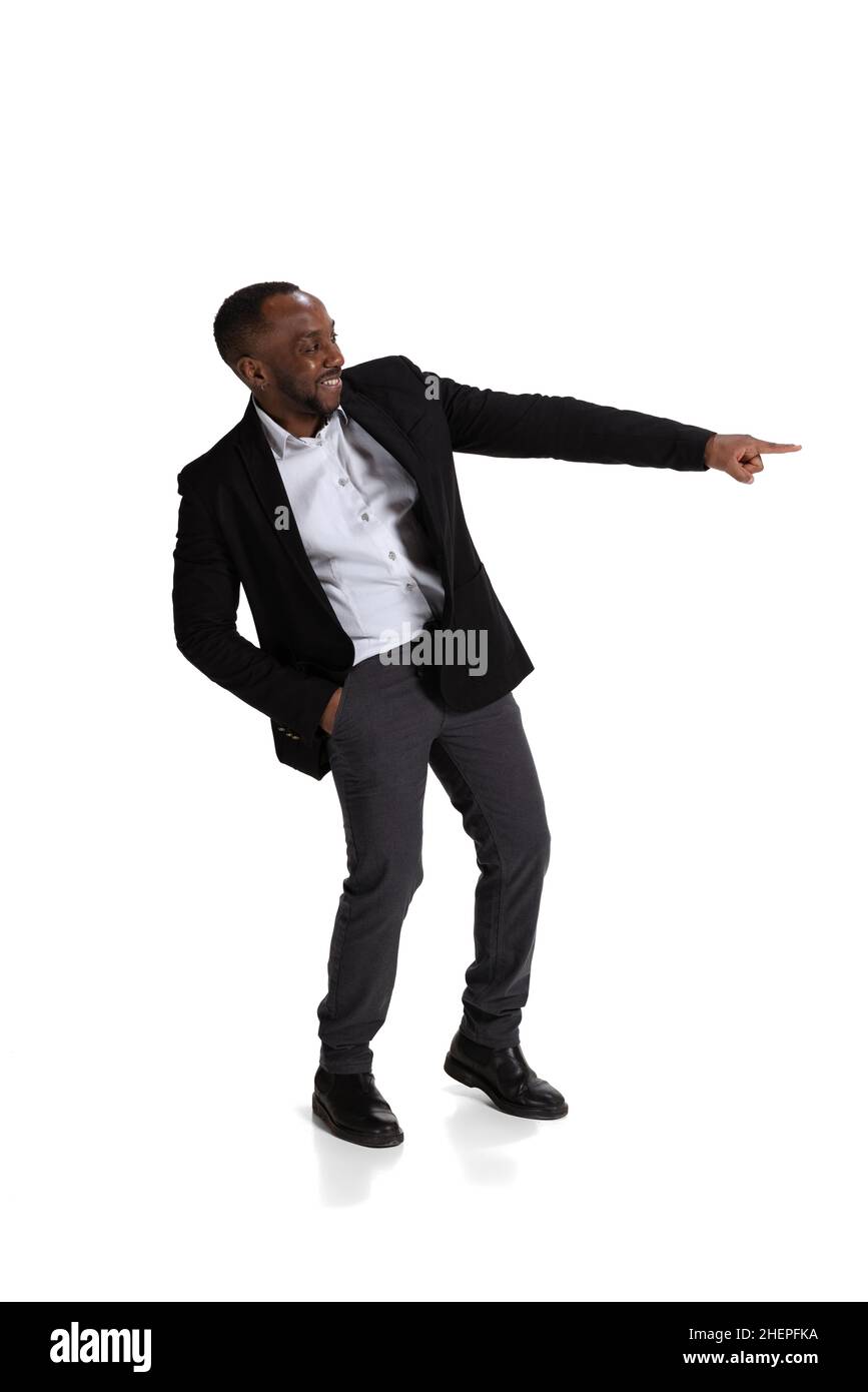 Full-length portrait of man, office worker pointing with laugh isolated ...