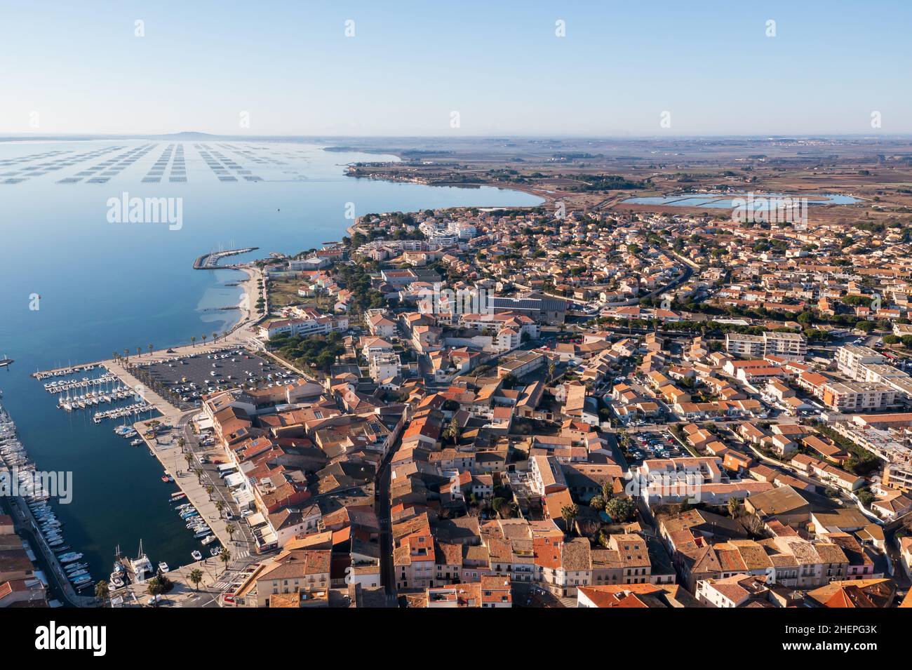 Aerial view of the village of Meze, on a winter morning, in Herault in ...