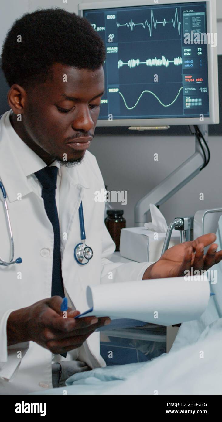 African american doctor consulting patient with IV drip bag. General ...