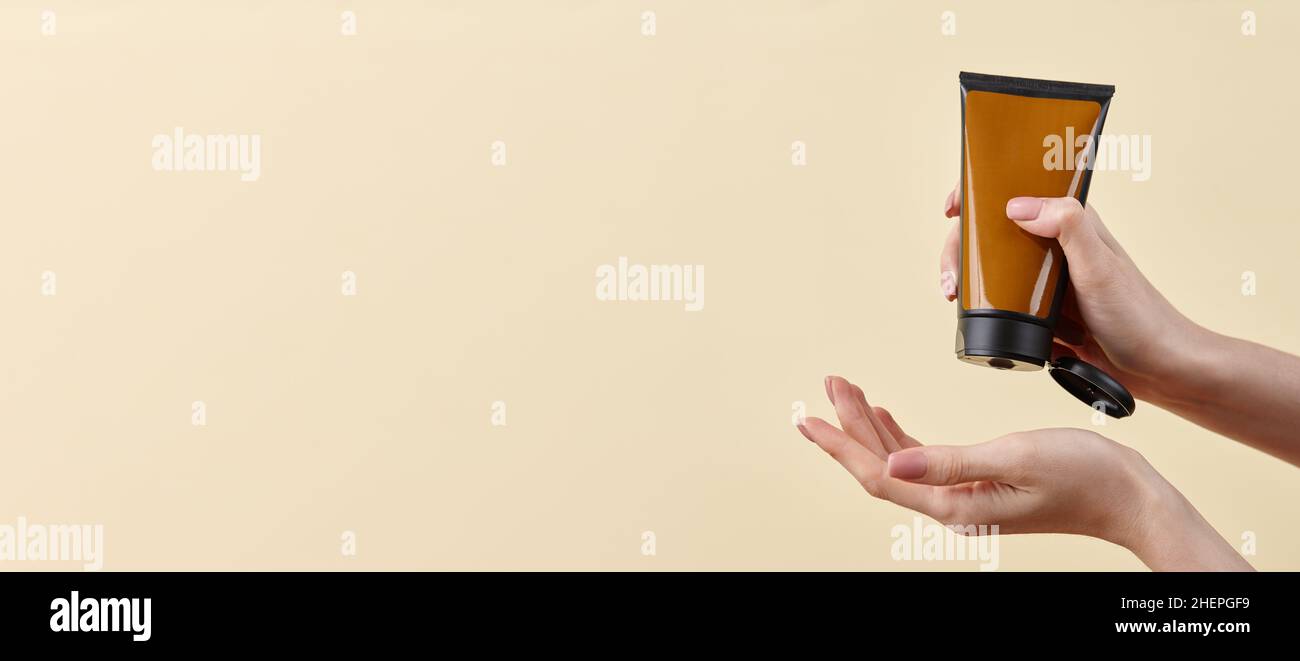 Woman applying skin care product to her hand Stock Photo - Alamy