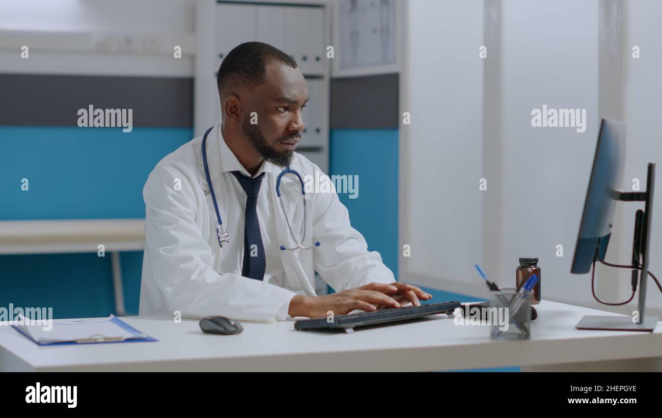 Checking symptoms on computer hi-res stock photography and images - Alamy