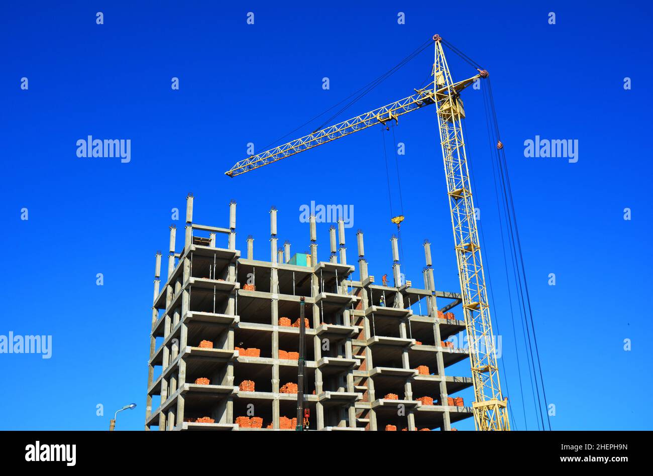 Industrial Building with Copy Space. Crane Building New House on the ...