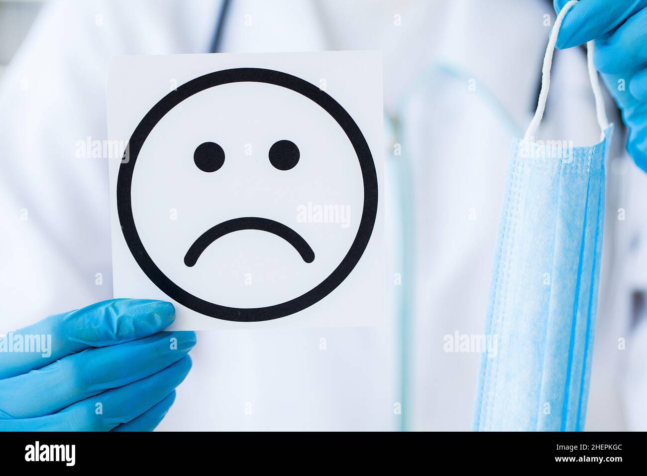 Doctor Holding a Cards With Symbol Sad Smile Stock Photo - Alamy