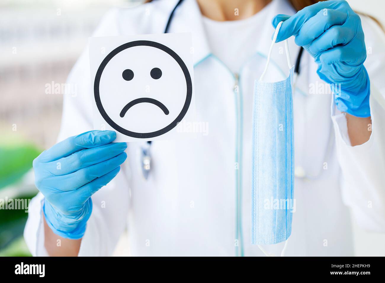 Doctor Holding a Cards With Symbol Sad Smile Stock Photo - Alamy