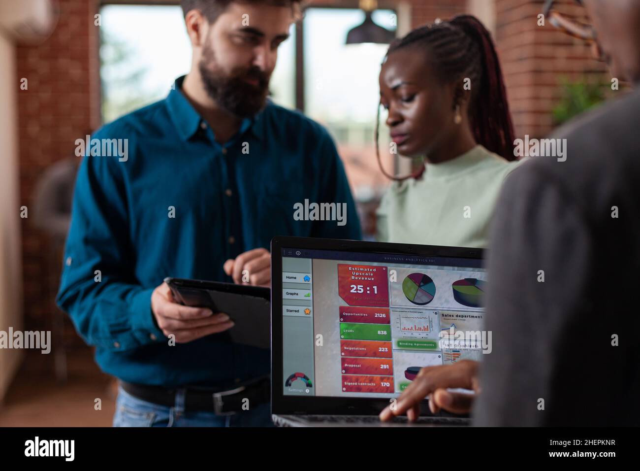 Diverse businesspeople analyzing company turnover working at marketing ...