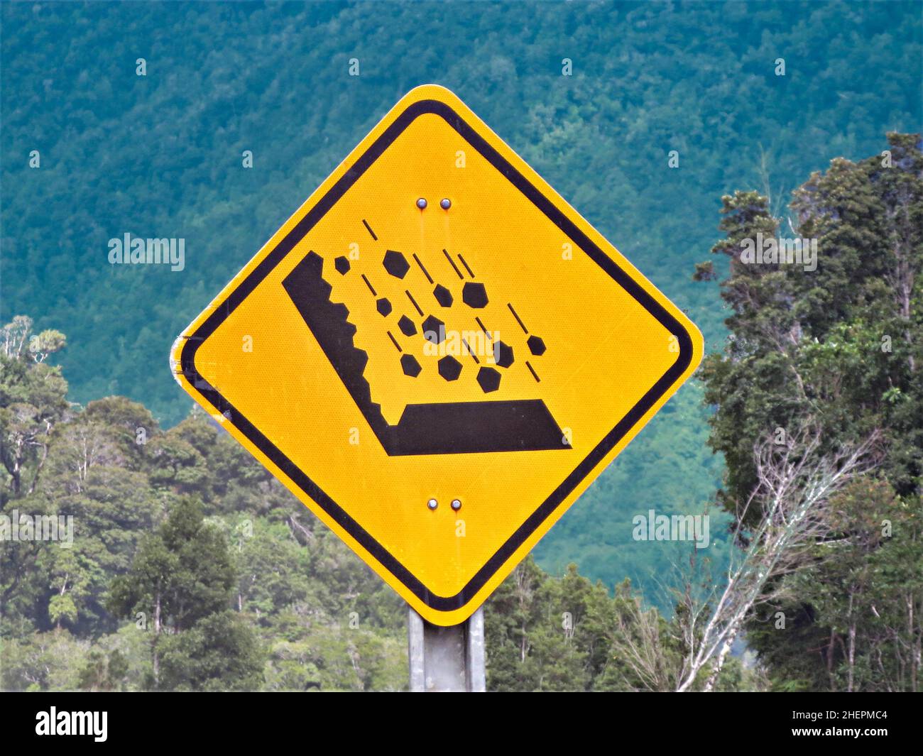 warning sign rockfall with blue sky in background, Patagonia Stock ...