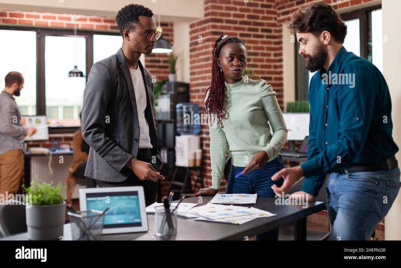 Diverse businesspeople discussing business collaboration analyzing ...