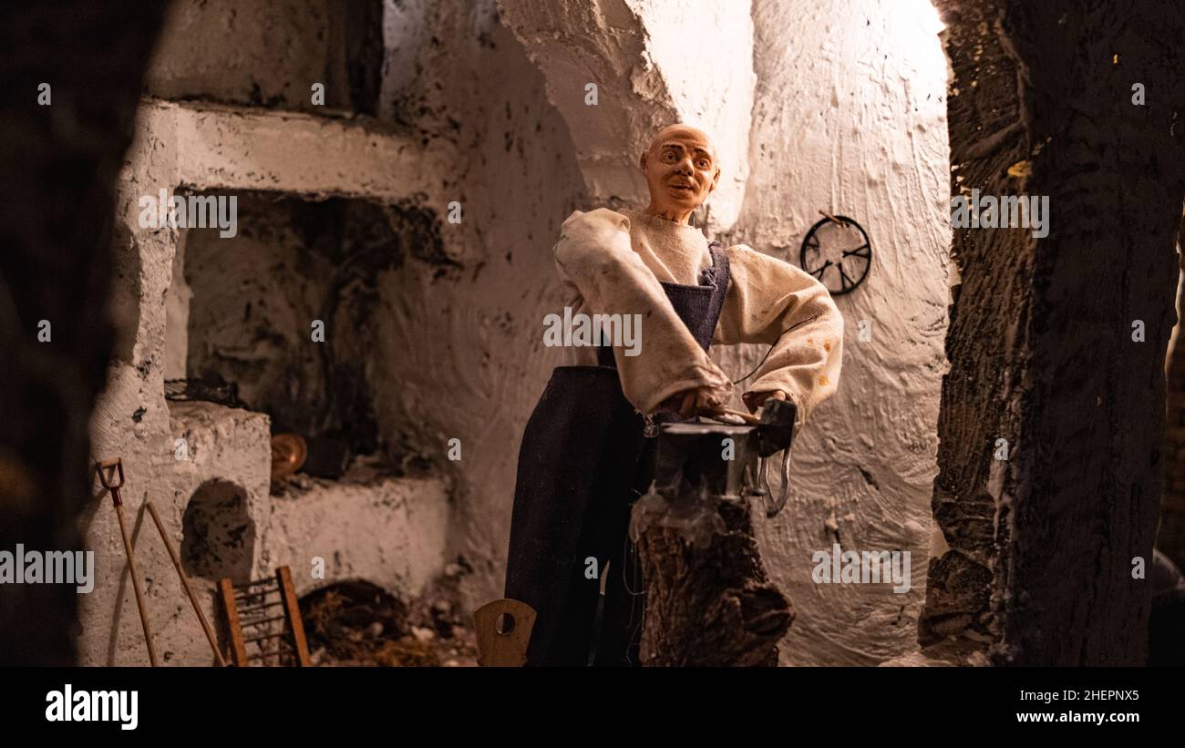detail of Nativity scene: blacksmith at work in the shop Stock Photo ...