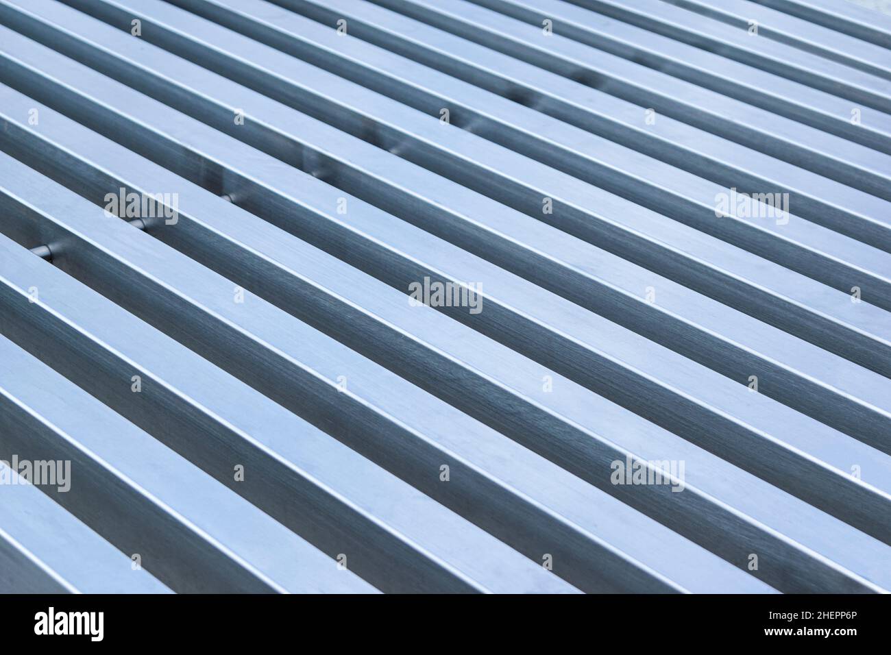 Rows of even metal strips close-up. Part of a metal item with rows of ...
