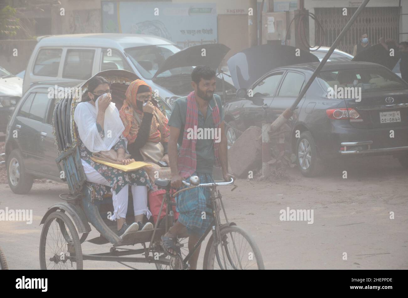 JANUARY 12,2022, DHAKA, BANGLADESH - Vehicles and motorcycles crossing ...