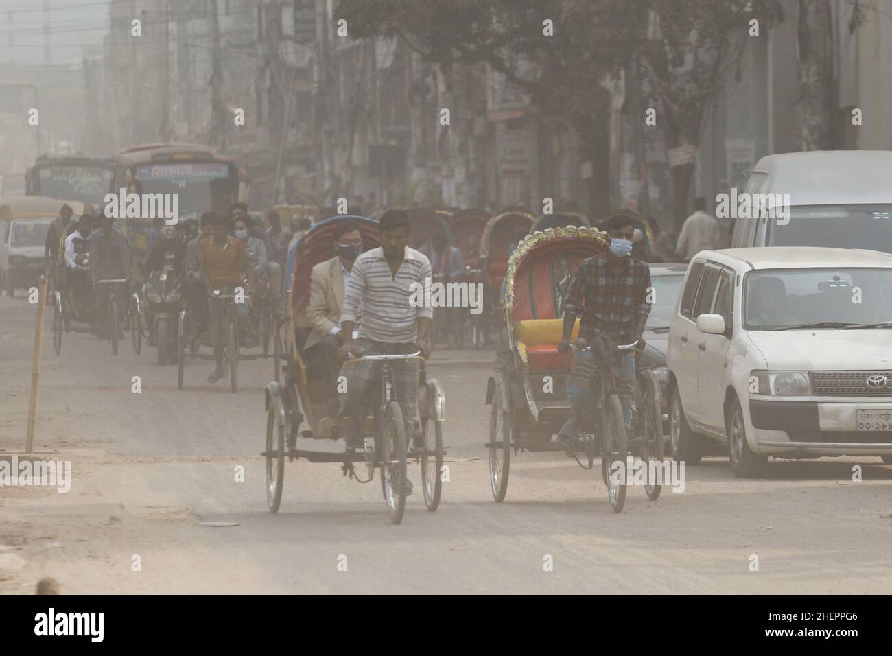 JANUARY 12,2022, DHAKA, BANGLADESH - Vehicles and motorcycles crossing ...
