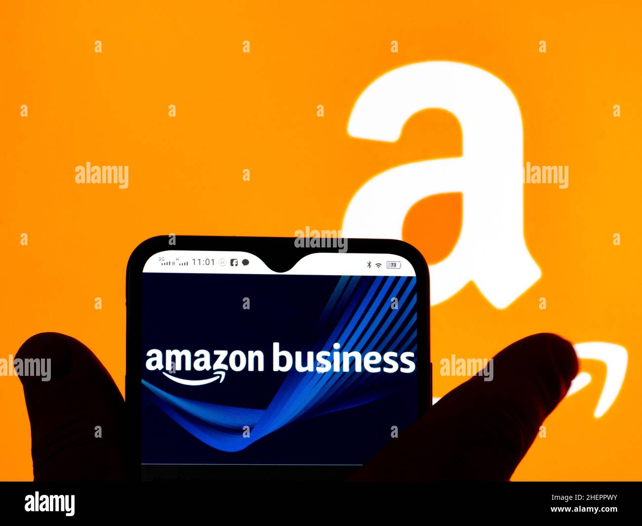 In this photo illustration, the Amazon Business logo is seen displayed ...