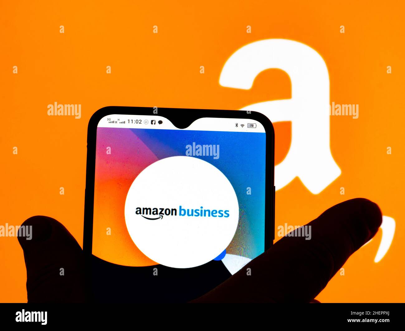 In this photo illustration, the Amazon Business logo is seen displayed ...