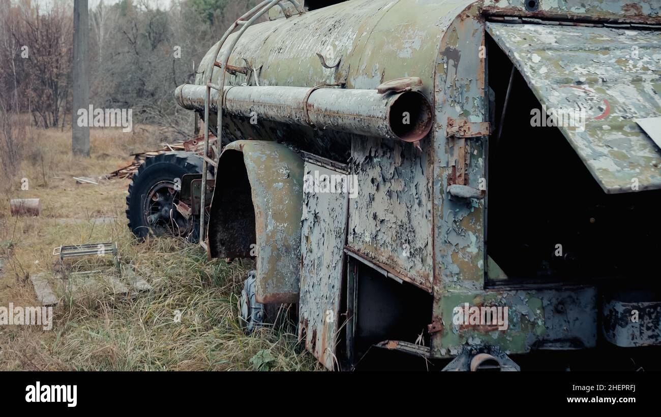damaged and rusty military vehicle in forest in chernobyl exclusion ...