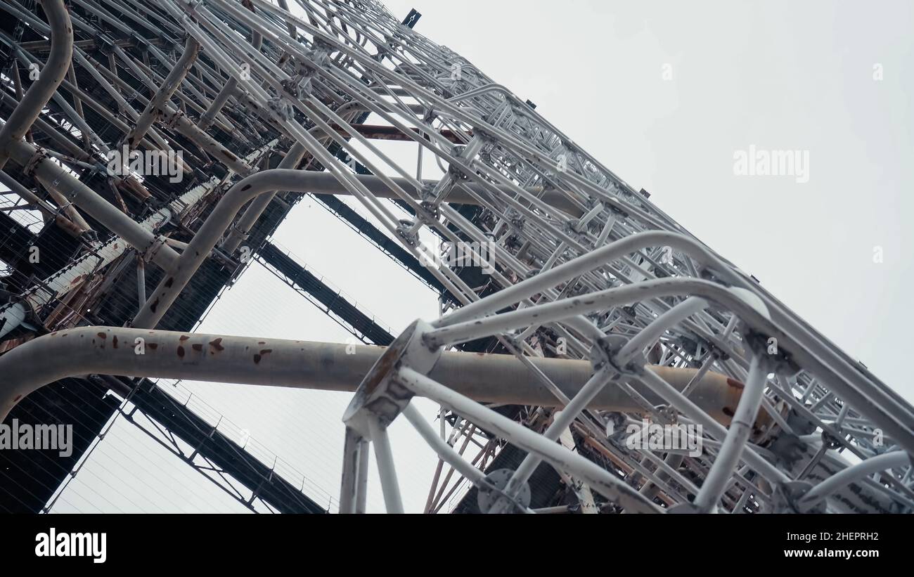 bottom view of old radio tower in chernobyl zone against grey sky Stock ...