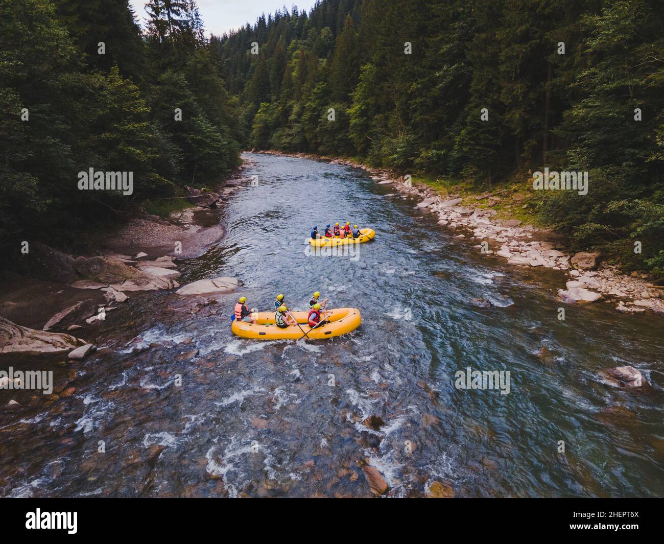 aerial view of mountain river people rafting in creek. extreme vitality ...