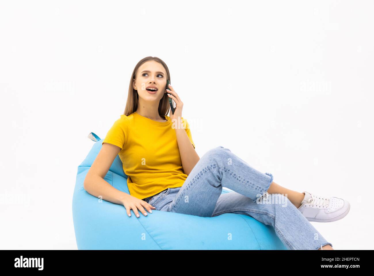 Girl sitting on beanbag chair hi-res stock photography and images - Alamy
