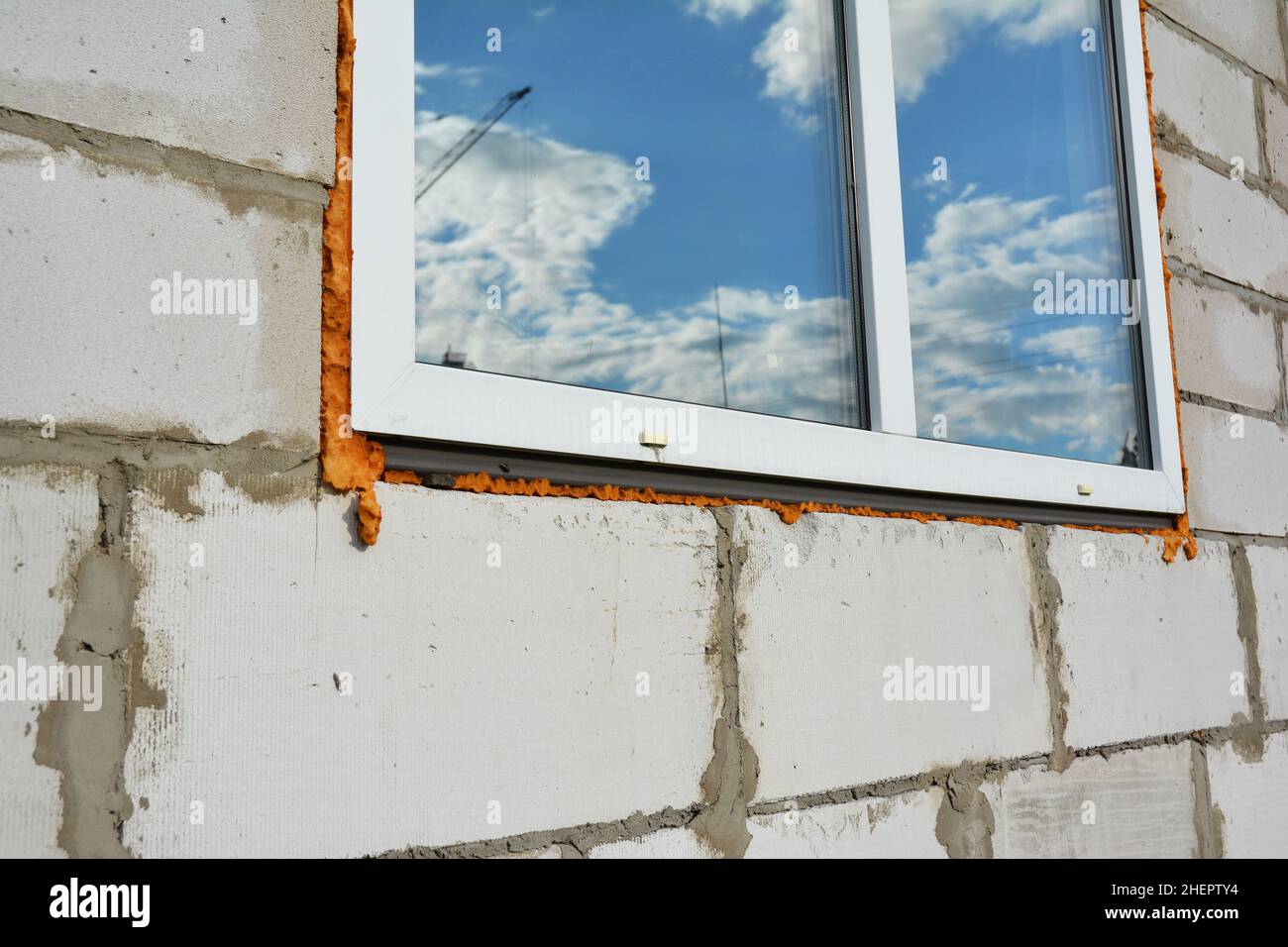 New Window Construction with Insulation Outdoor. Window installation ...
