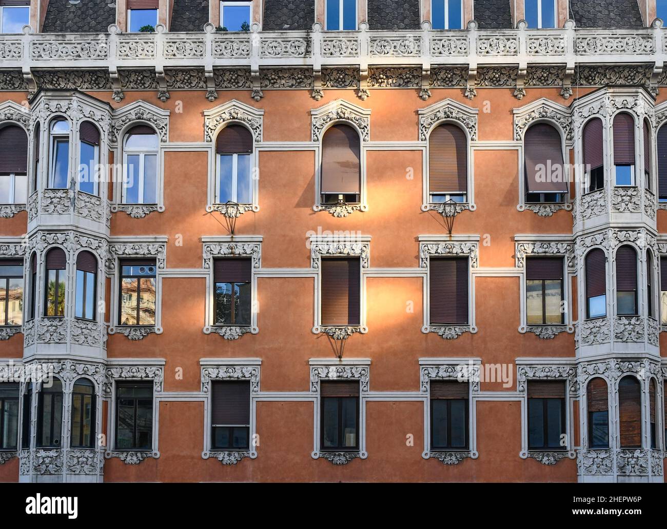 Detail of the façade of an Art Nouveau palace embellished with two bow ...