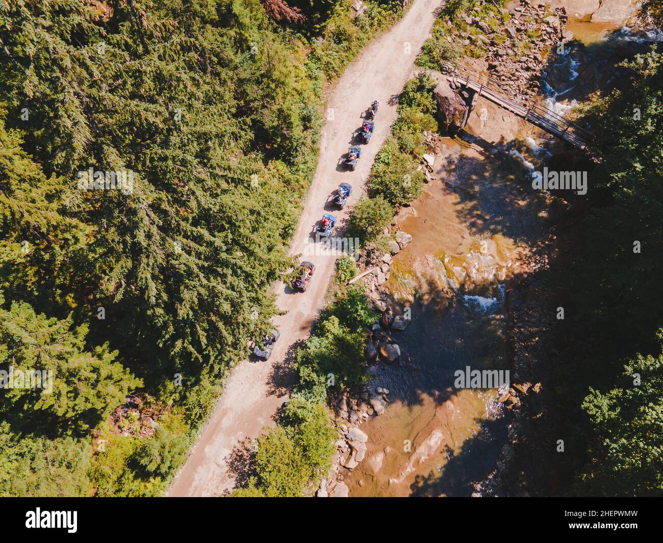 aerial view of quad bike riders at mountain trail road copy space Stock ...