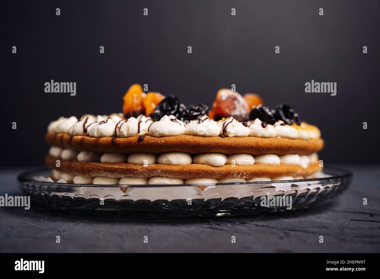 Delicious beautiful round sponge layered cream cake decorated with ...