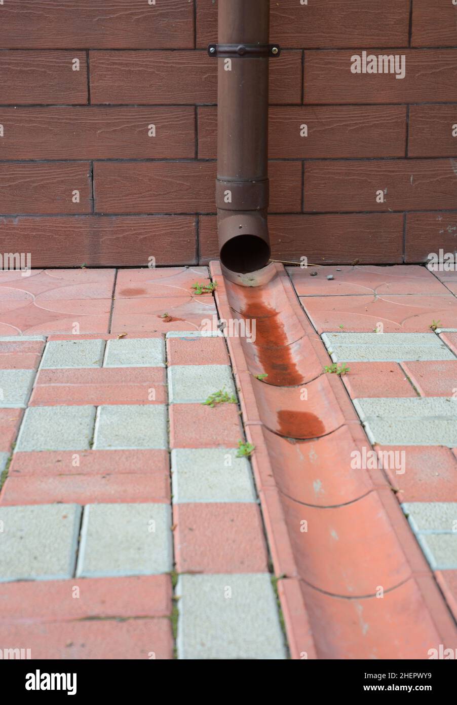 Rain gutter downspout pipe for roof runoff with open water drainage in ...