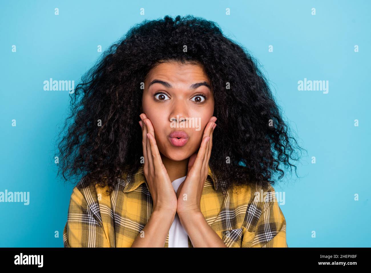 Photo of excited shocked lady hands cheeks open mouth wear checkered ...
