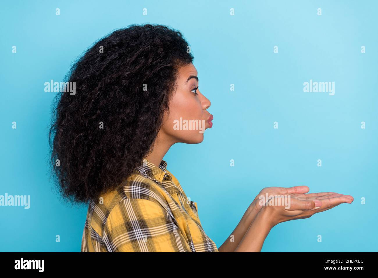 Profile photo of affectionate lady hold palms send air kiss wear ...