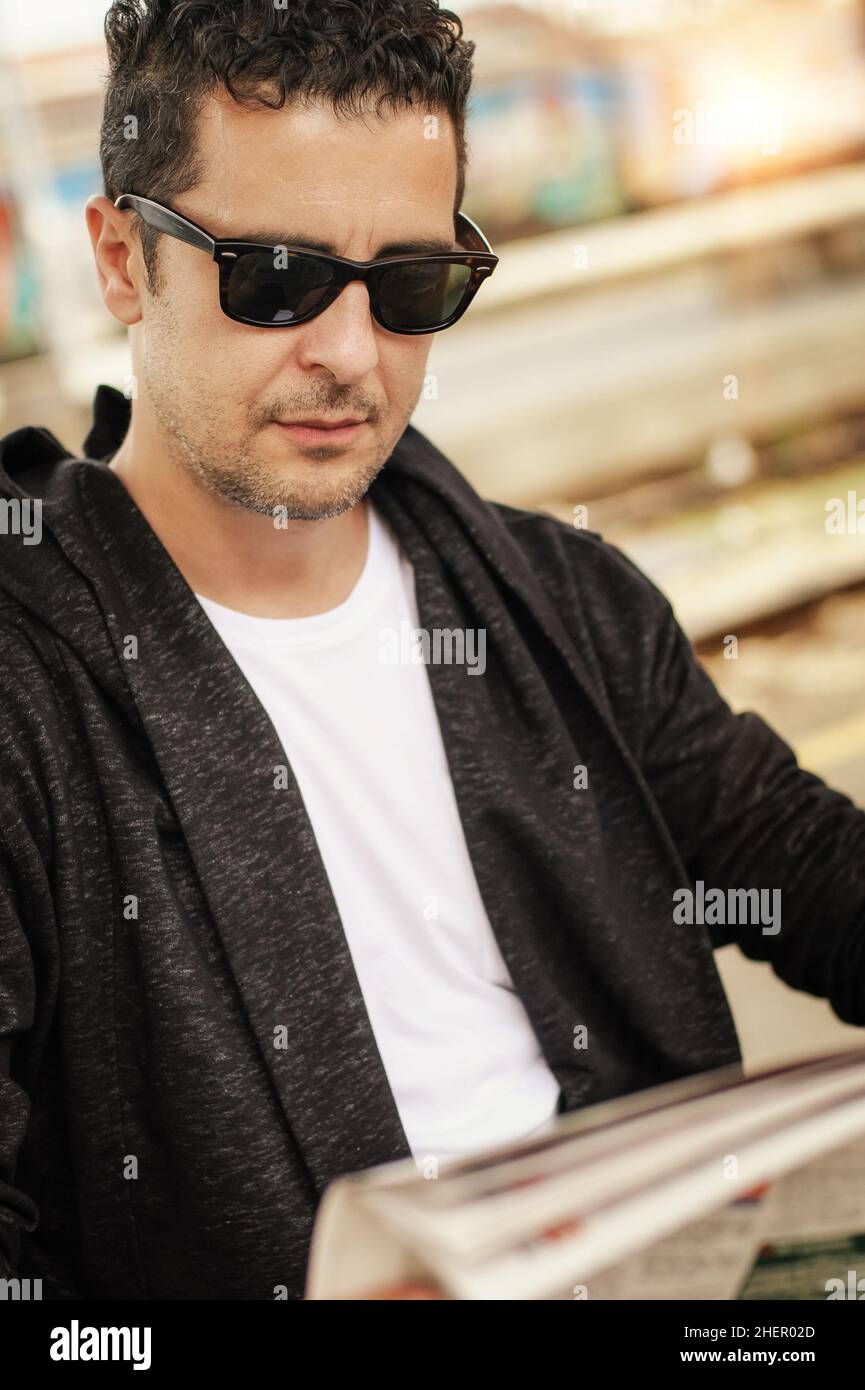 Beautiful man reading newspaper hi-res stock photography and images - Alamy