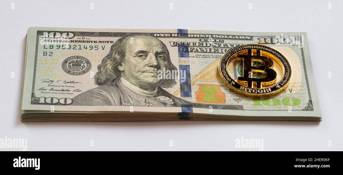 Bitcoin on 100 dollar bill background for design purpose Stock Photo ...