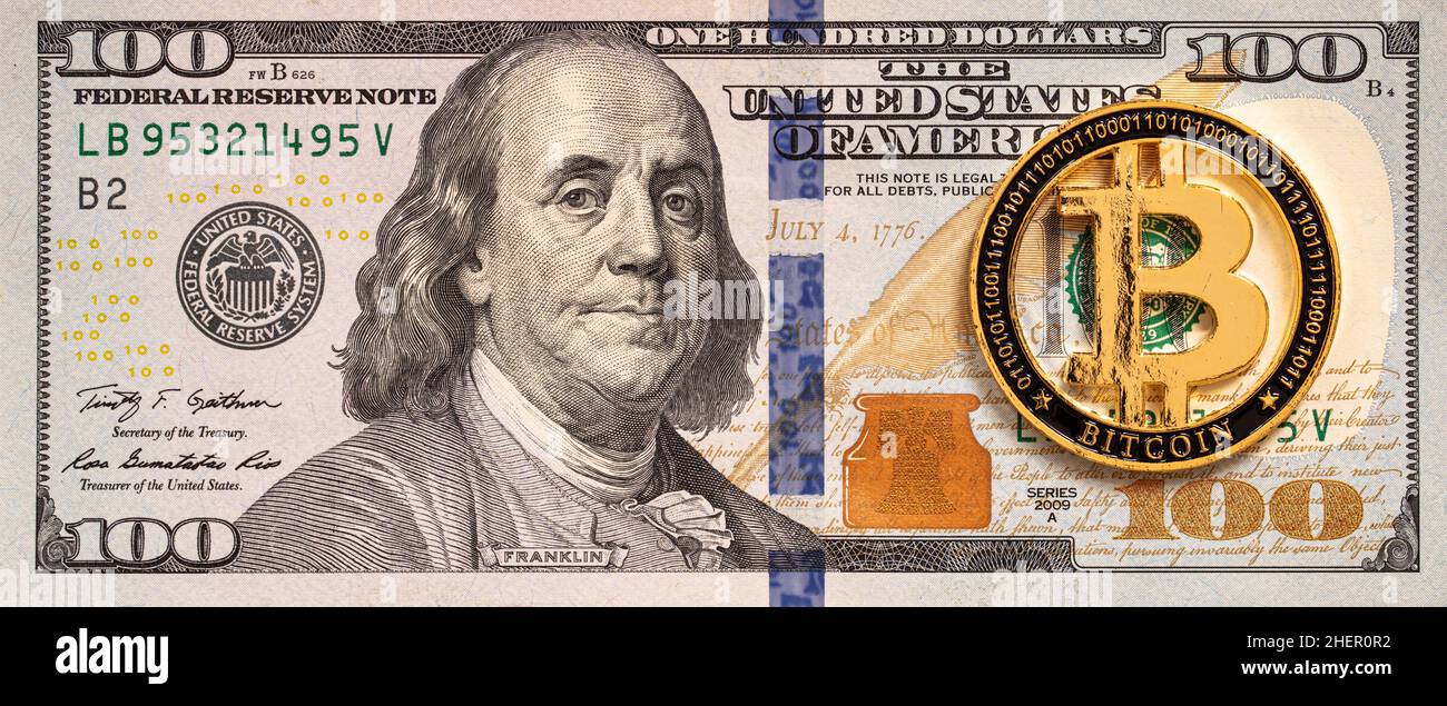 Bitcoin on 100 dollar bill background for design purpose Stock Photo ...