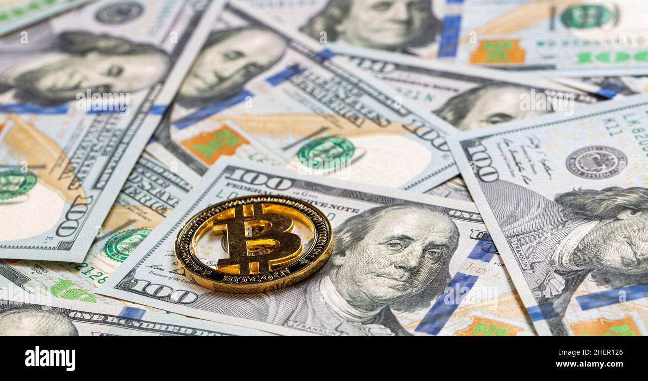 Bitcoin on 100 dollar bill background for design purpose Stock Photo ...