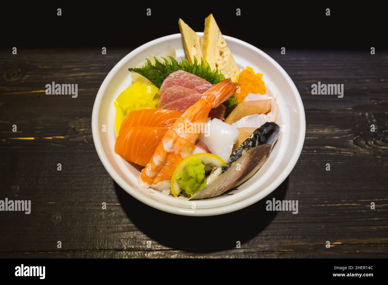 Top view of Sashimi Don, Danburi or Japanese rice bowl with various raw ...