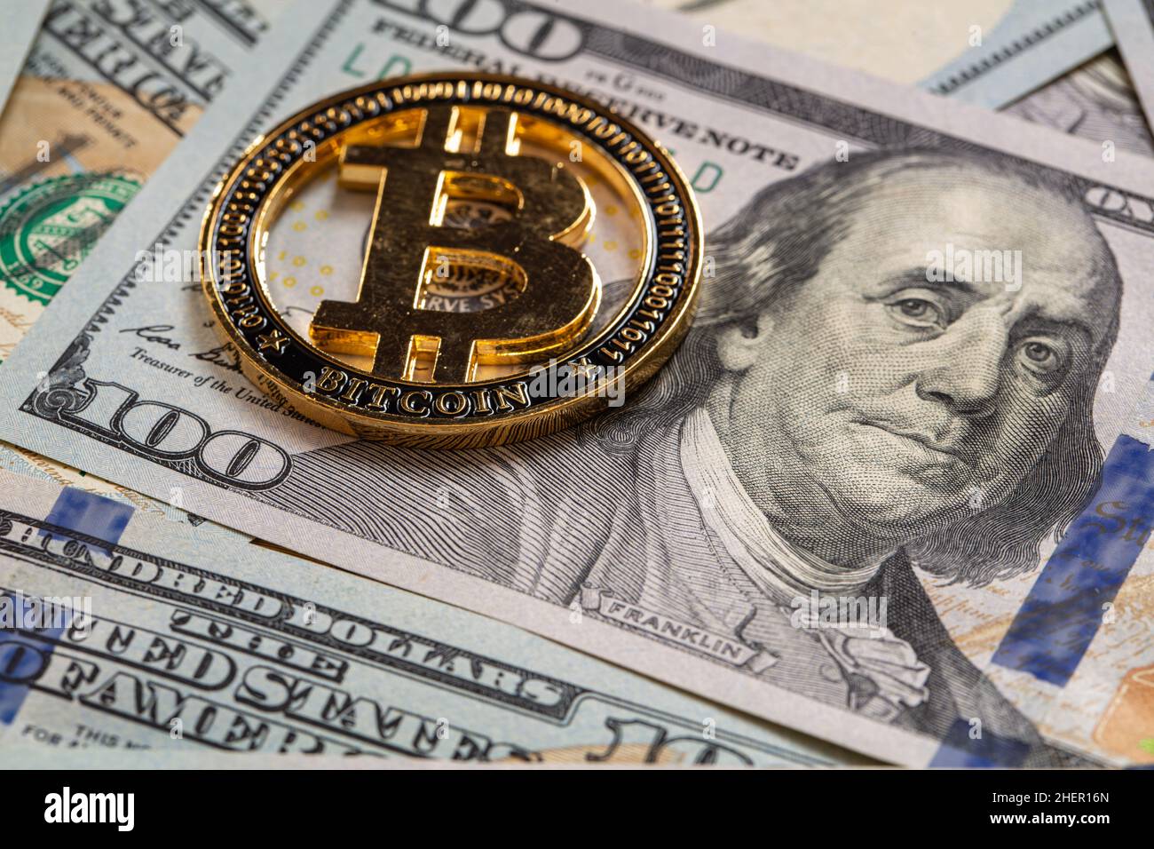 Bitcoin on 100 dollar bill background for design purpose Stock Photo ...