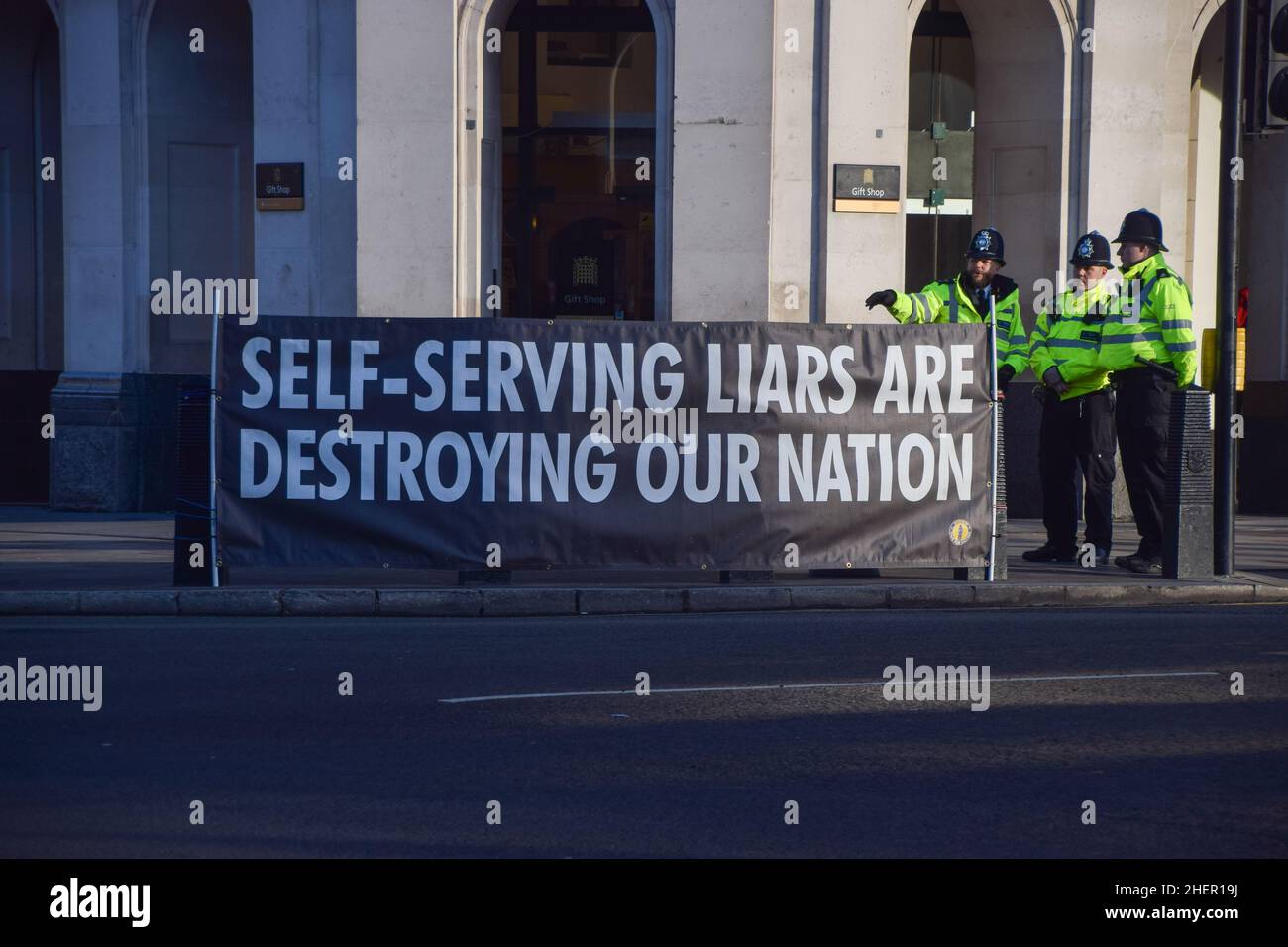 London, UK 12th January 2022. Anti-Tory banner at Parliament Square ...