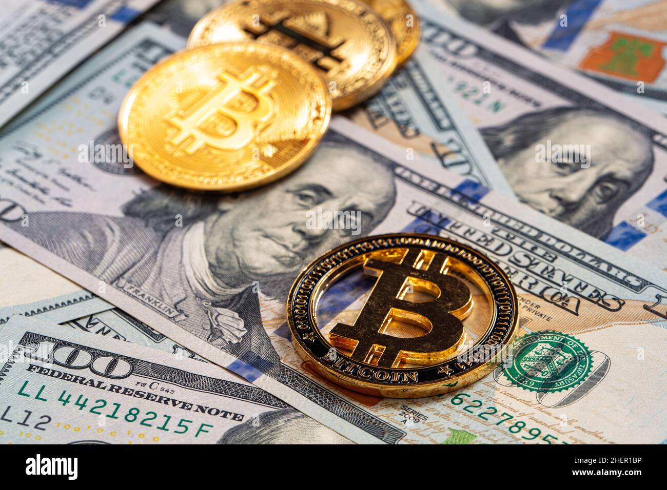 Bitcoin on 100 dollar bill background for design purpose Stock Photo ...