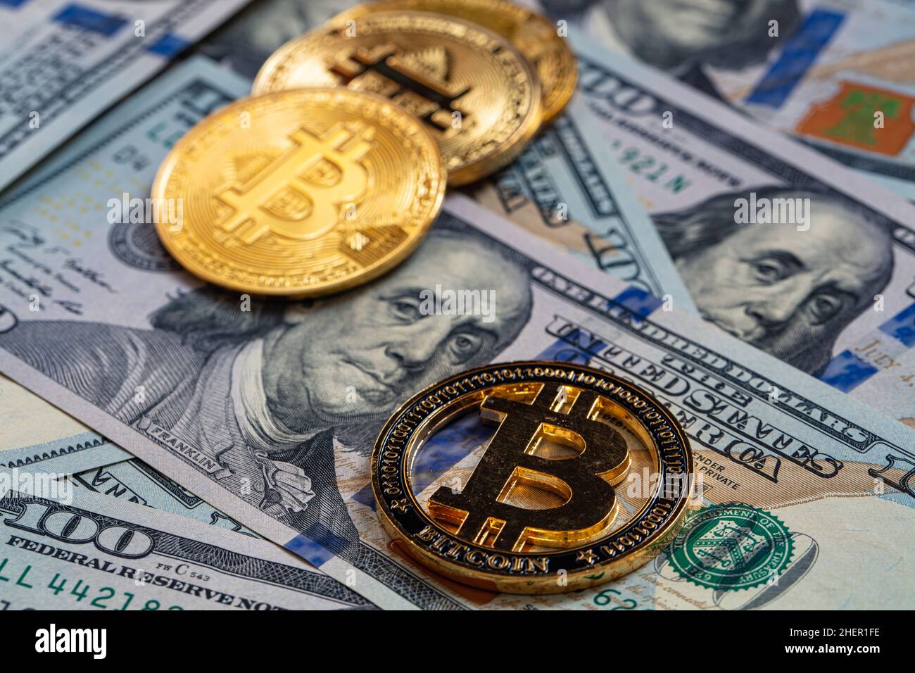 Bitcoin on 100 dollar bill background for design purpose Stock Photo ...