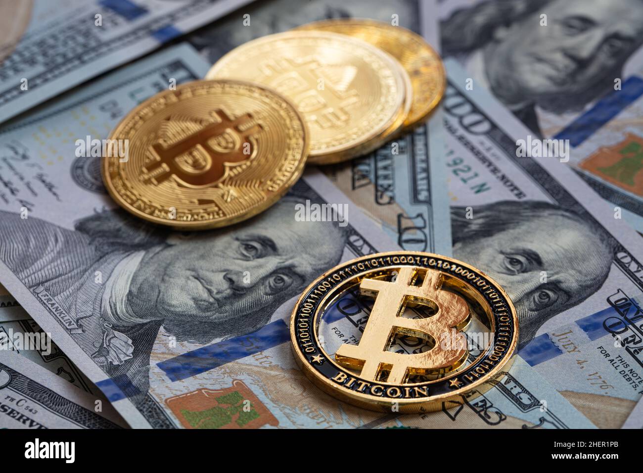 Bitcoin on 100 dollar bill background for design purpose Stock Photo ...