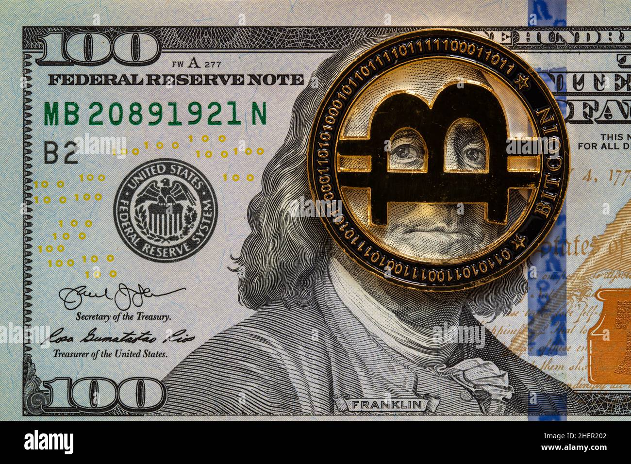 Bitcoin on 100 dollar bill background for design purpose Stock Photo ...